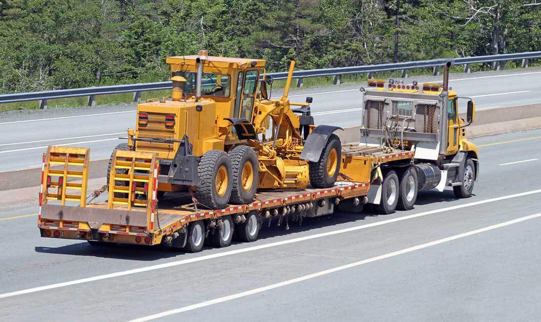 Safety Tips for Transporting Heavy Equipment - Omnia Machinery Safety Tips for Transporting Heavy Equipment - Omnia Machinery